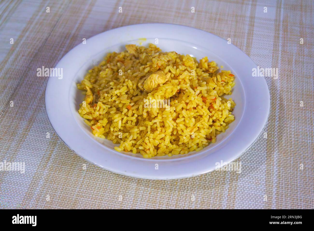 Portion of beef pilaf on a white background. Long grain rice ...