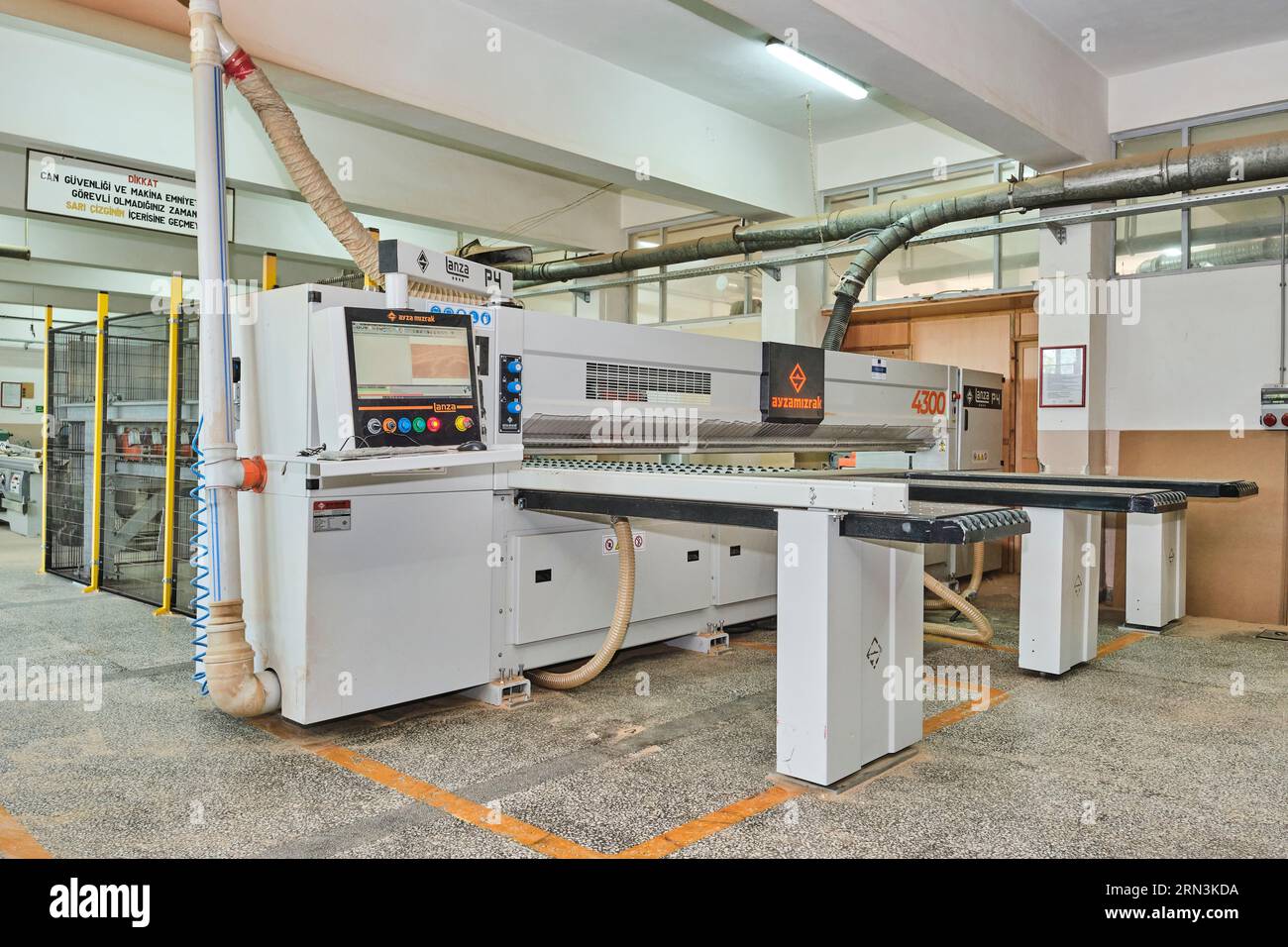 many identical industrial machinery in a row at a factory. equipment of ...