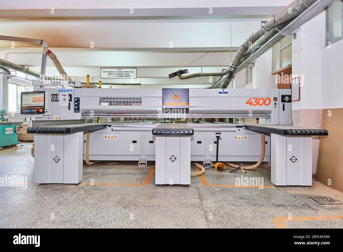 many identical industrial machinery in a row at a factory. equipment of ...