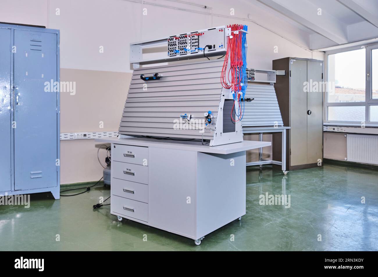 many identical industrial machinery in a row at a factory. equipment of ...