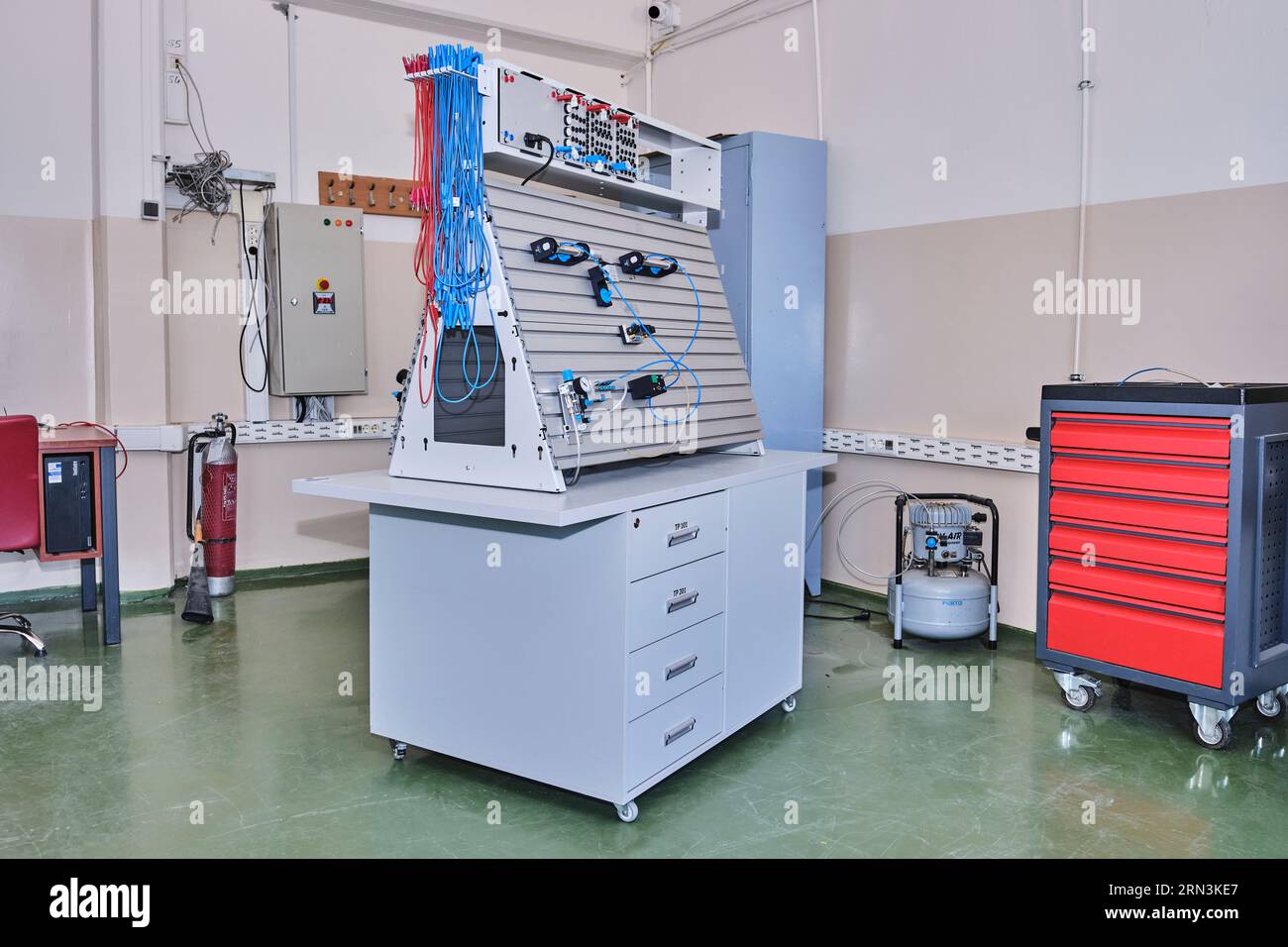 many identical industrial machinery in a row at a factory. equipment of ...