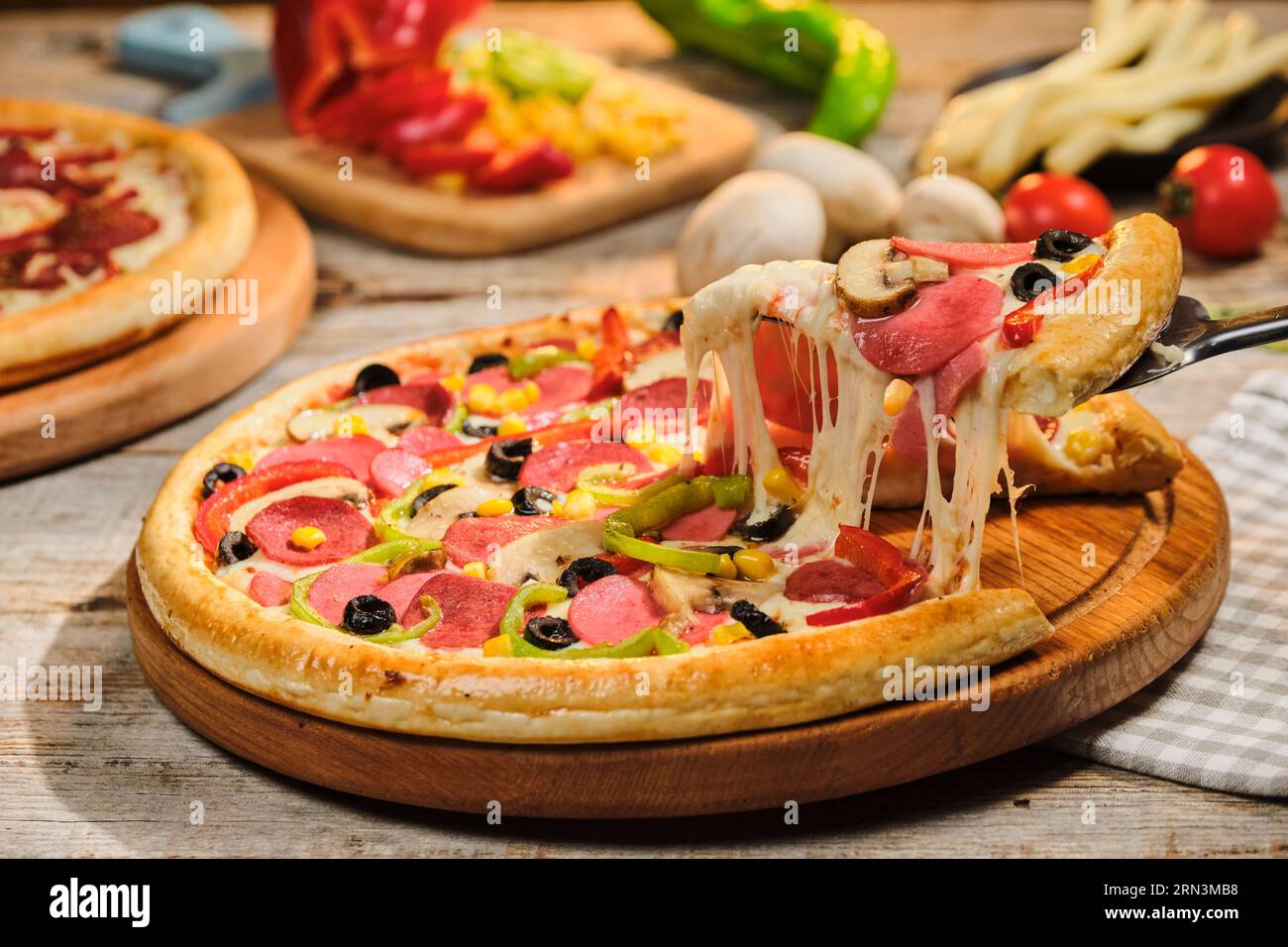 pizza photo shoot with top and side shots pizza on wooden board. Top ...