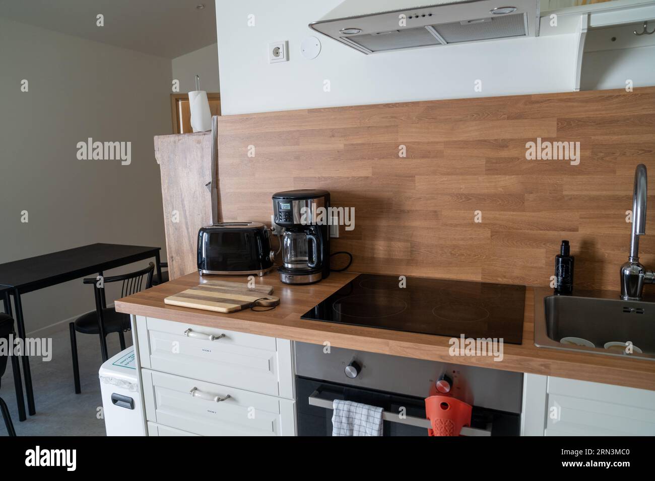 Modern interior of a european style kitchen, with counters, oven, sink ...