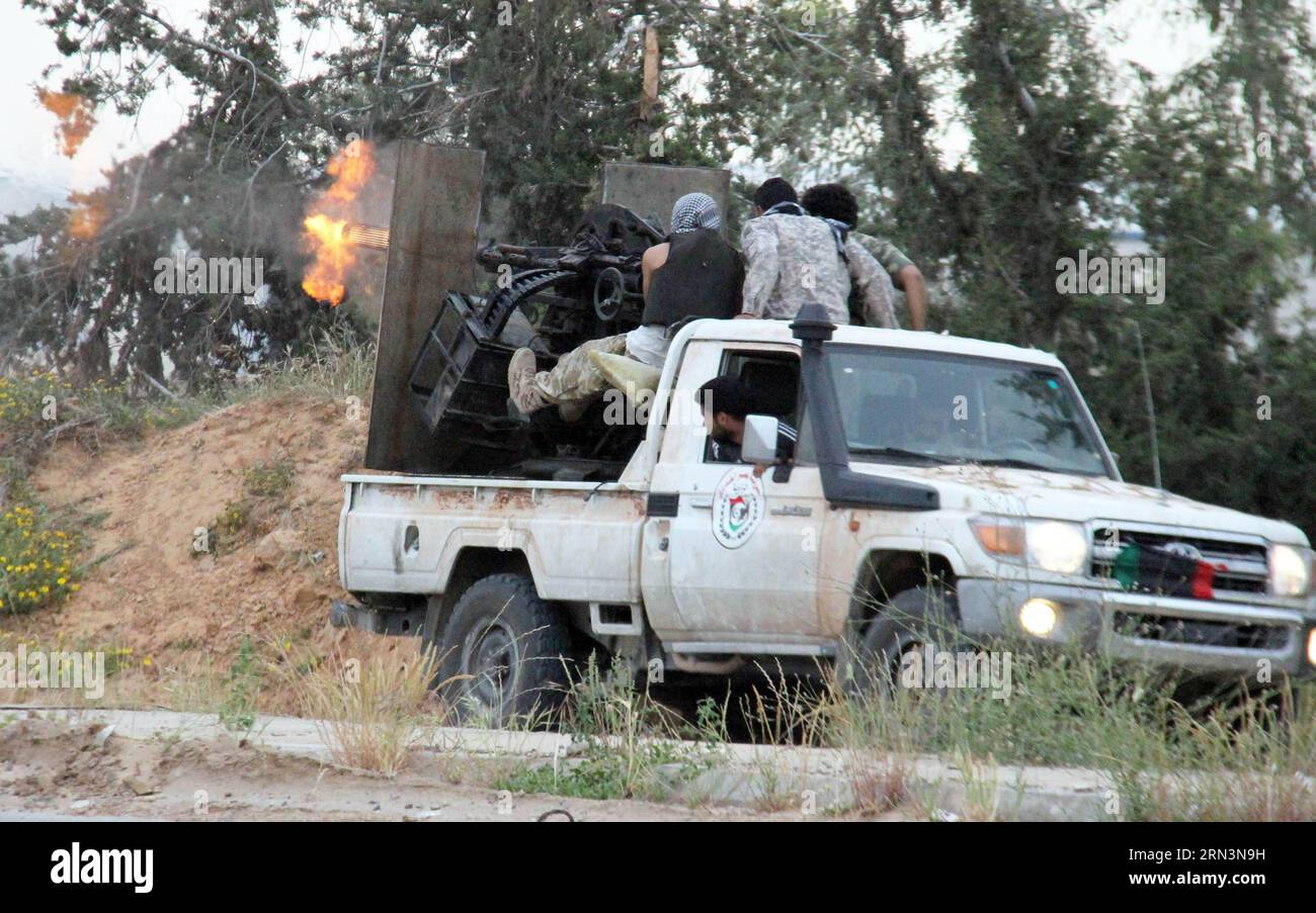 (150422) -- TRIPOLI, April 22, 2015 -- A Libya Dawn fighter fires as ...