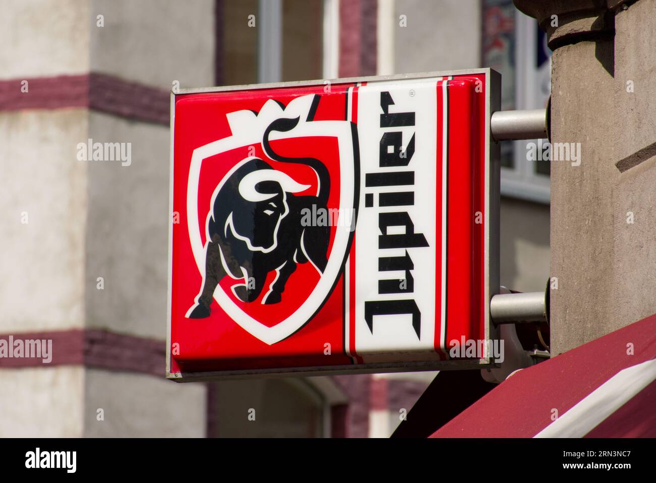 The logo sign of JUPILER, A Belgian beer. Shot outside a cafe in the ...