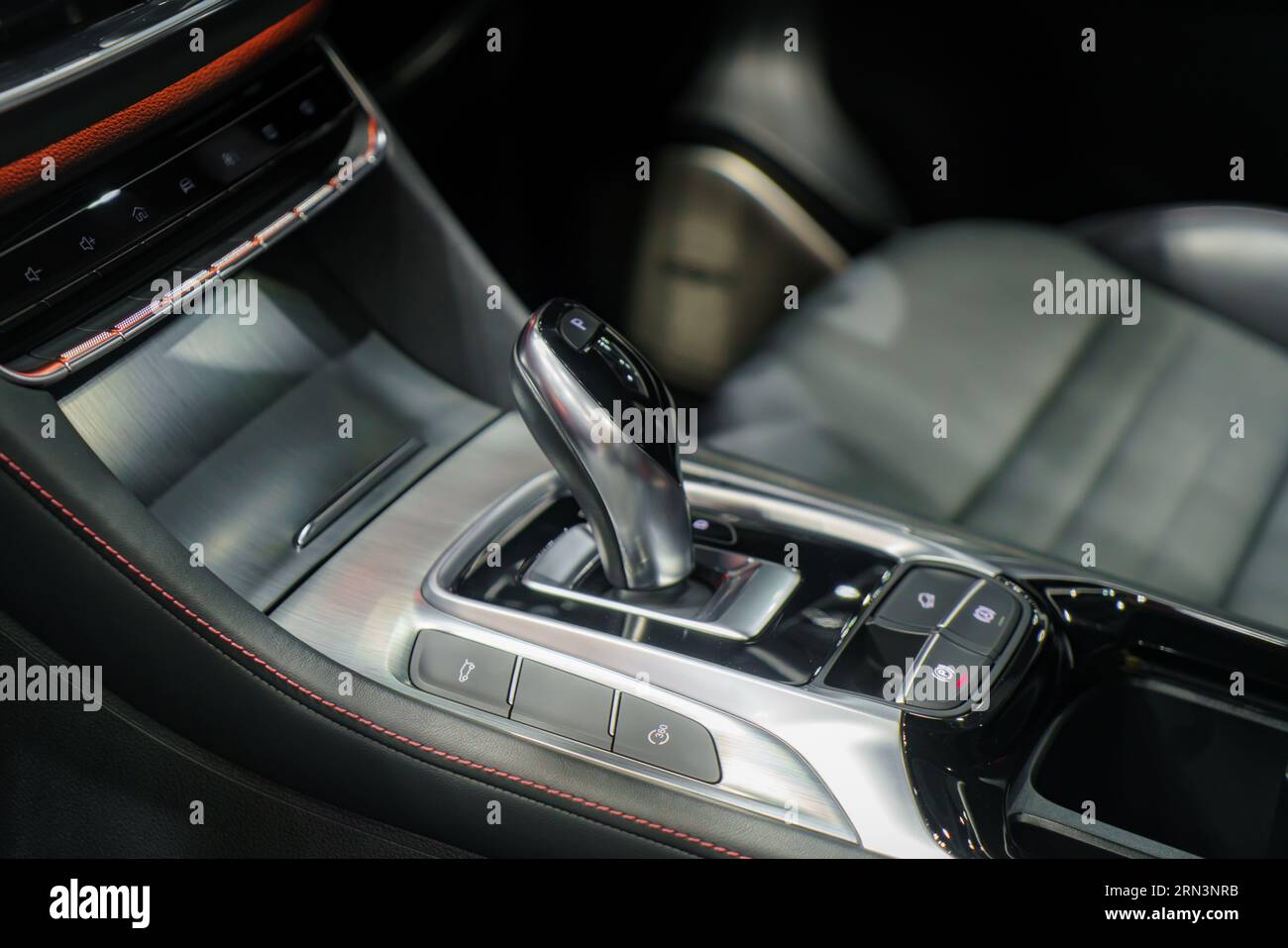 EV gear shift, a blend of form and function. Illuminated buttons beckon ...
