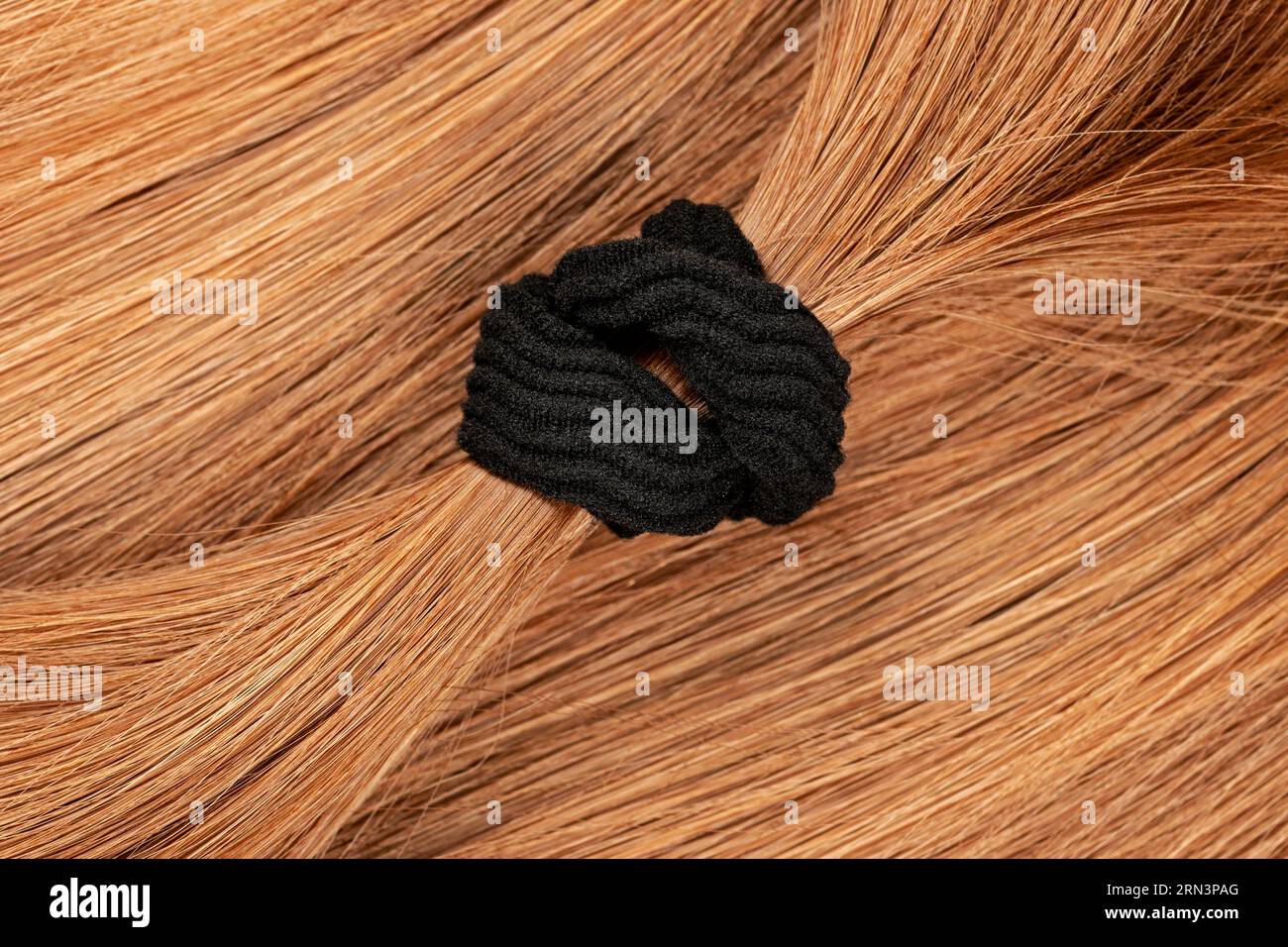 Red hair tied with black hair band Stock Photo - Alamy