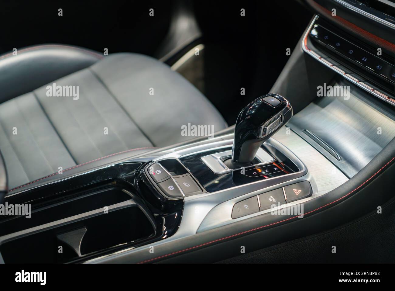 EV gear shift, a blend of form and function. Illuminated buttons beckon ...