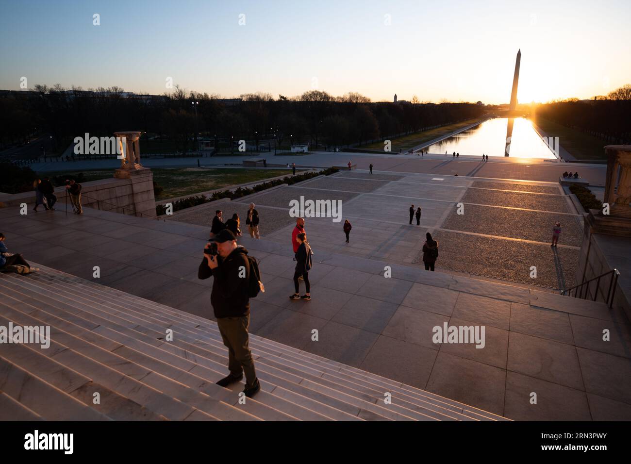 Lincoln Memorial Sunrise Visitors Washington DC // WASHINGTON DC — Visitors watch the sunrise ...