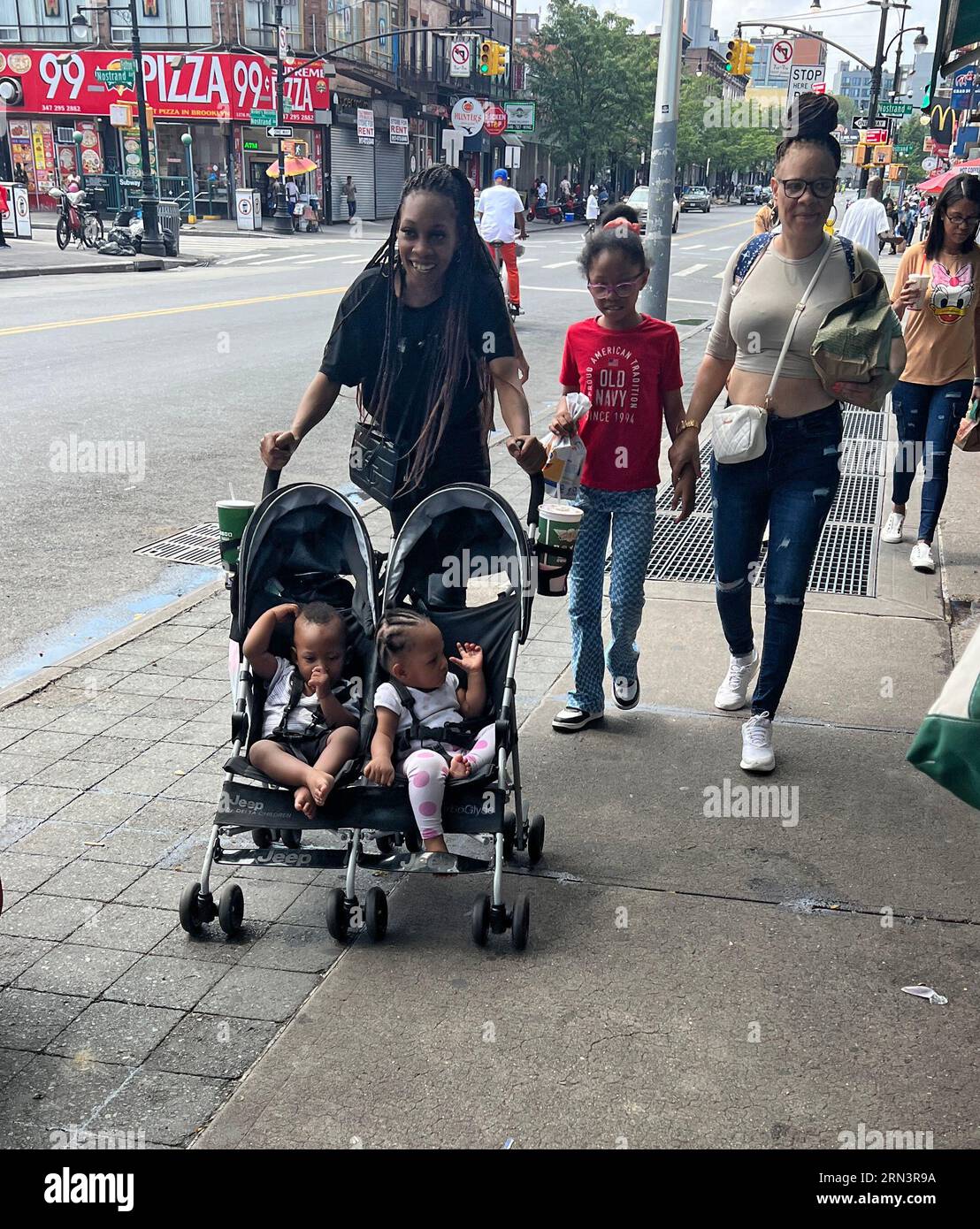 American children walking along street hi-res stock photography and ...