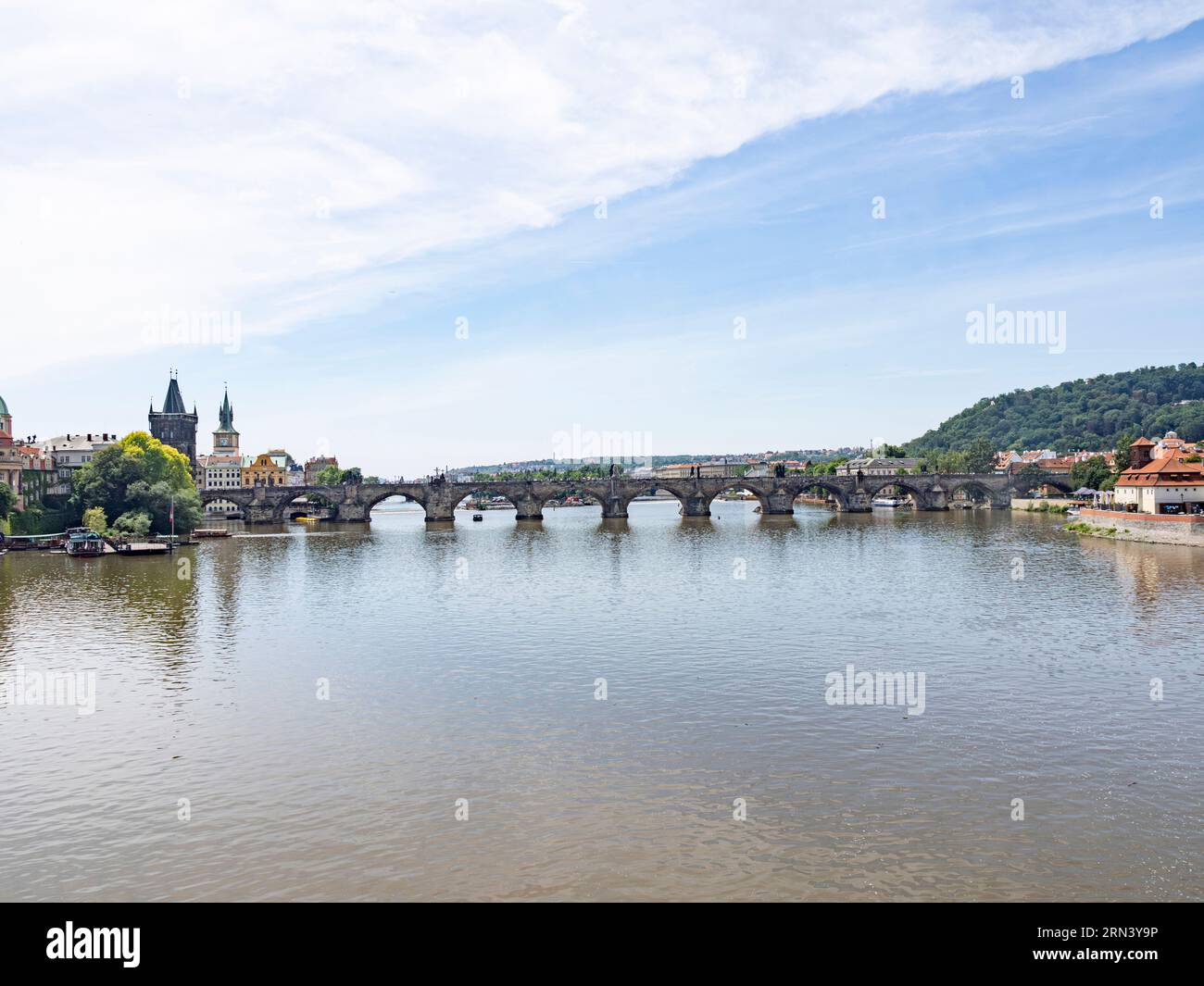 The multiple arches of the pedestrian bridge, Charles Bridge, span the ...