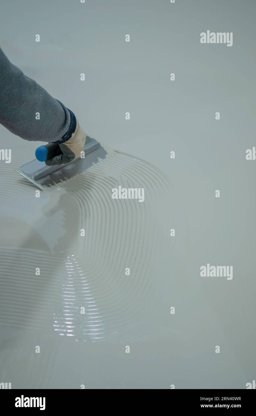 Applying flooring hi-res stock photography and images - Alamy