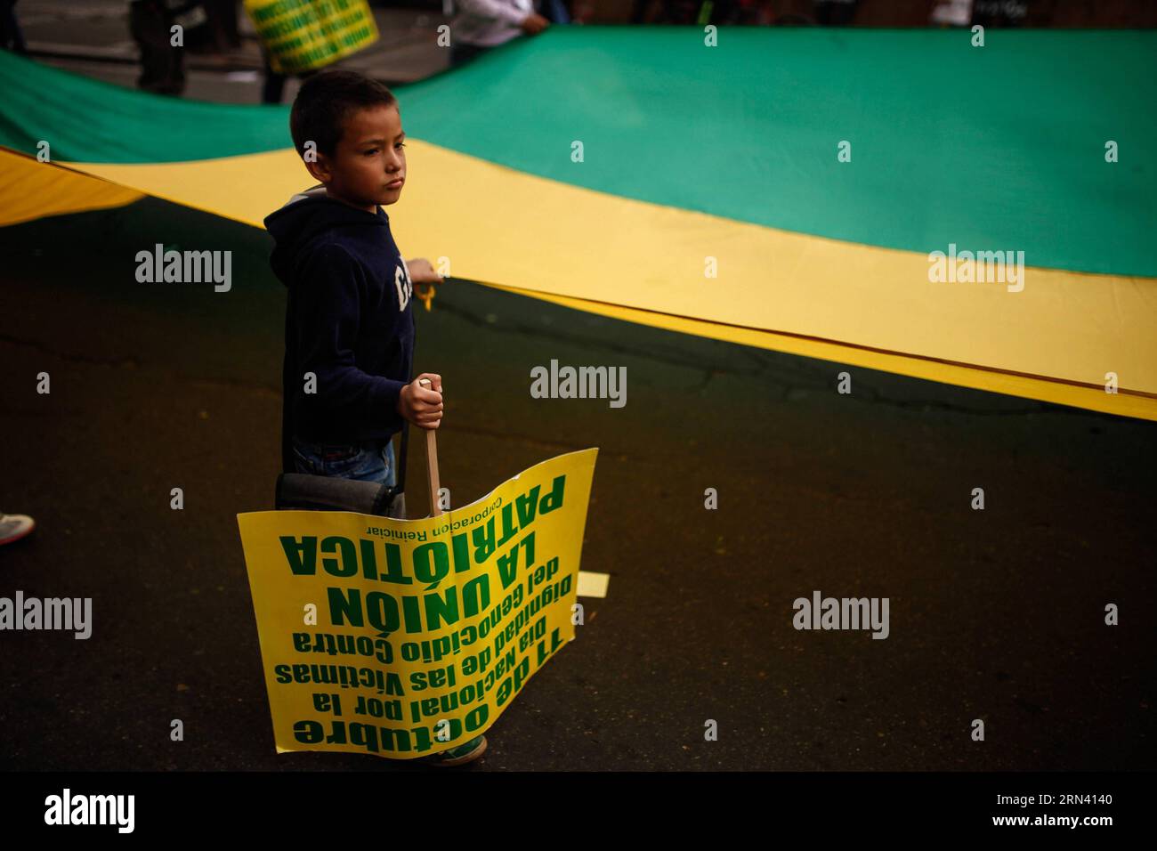 BOGOTA, May 1, 2015 -- A boy takes part in a march in comemmoration of ...