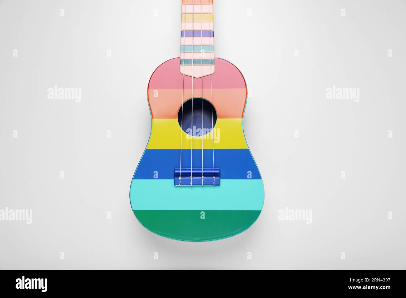 Colorful ukulele on white background, top view. String musical ...
