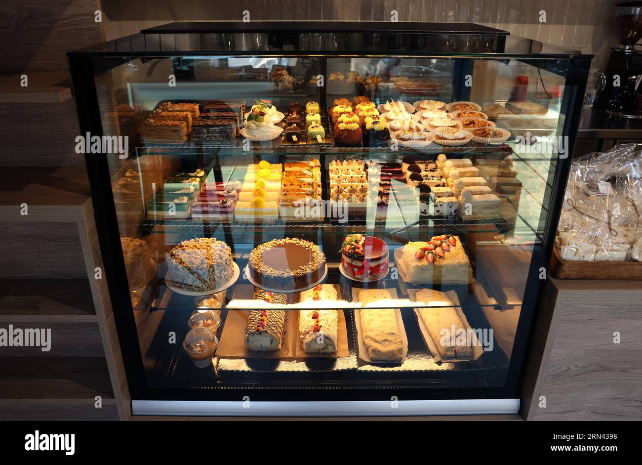 Counter with different tasty desserts in bakery shop Stock Photo - Alamy