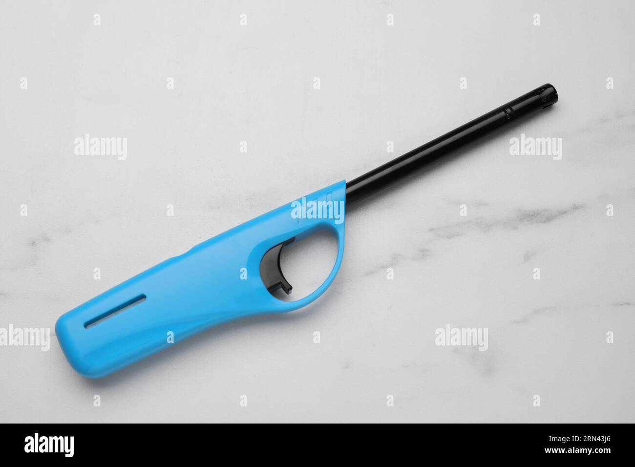 One gas lighter on white marble table, top view Stock Photo - Alamy