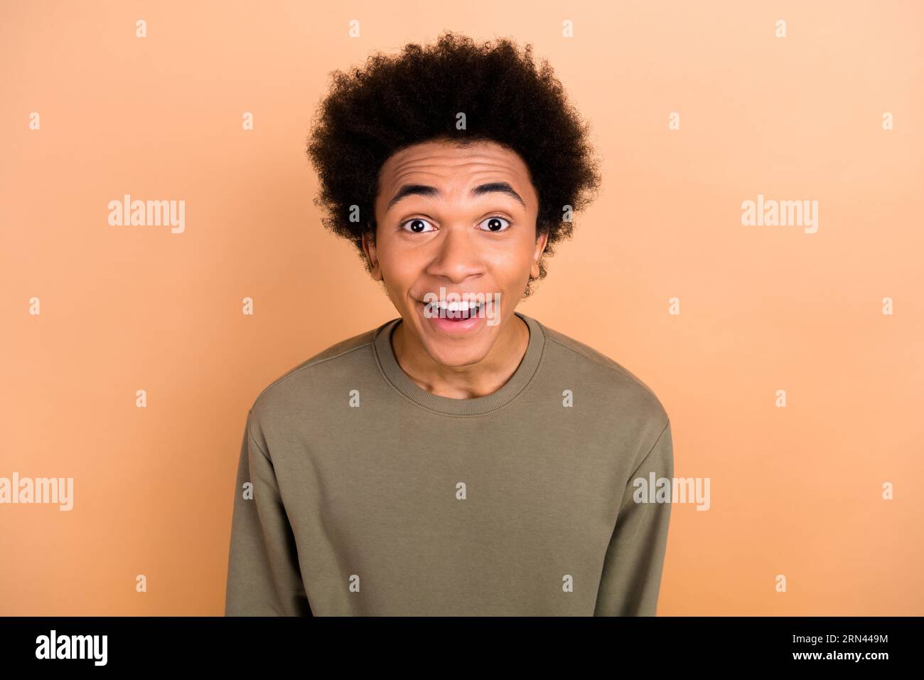 Portrait of astonished speechless person with afro hairdo dressed khaki ...