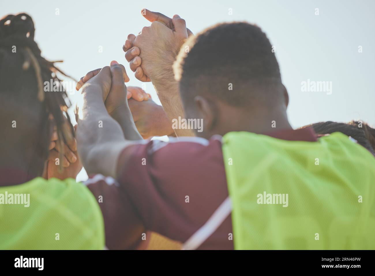 Football, teamwork and men holding hands, fitness and cooperation with ...