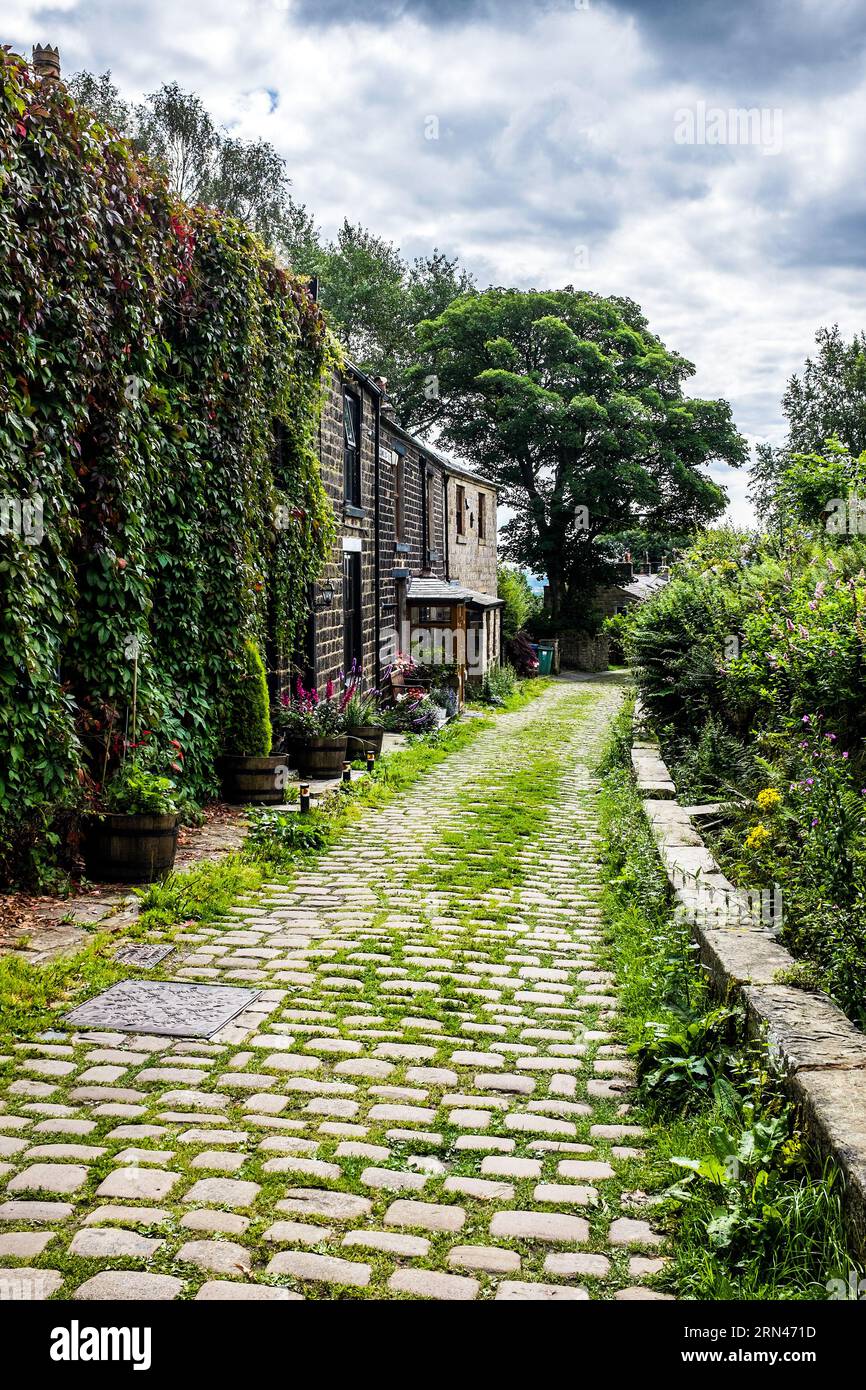 View of a cobbled street in a Lancashire village Stock Photo - Alamy