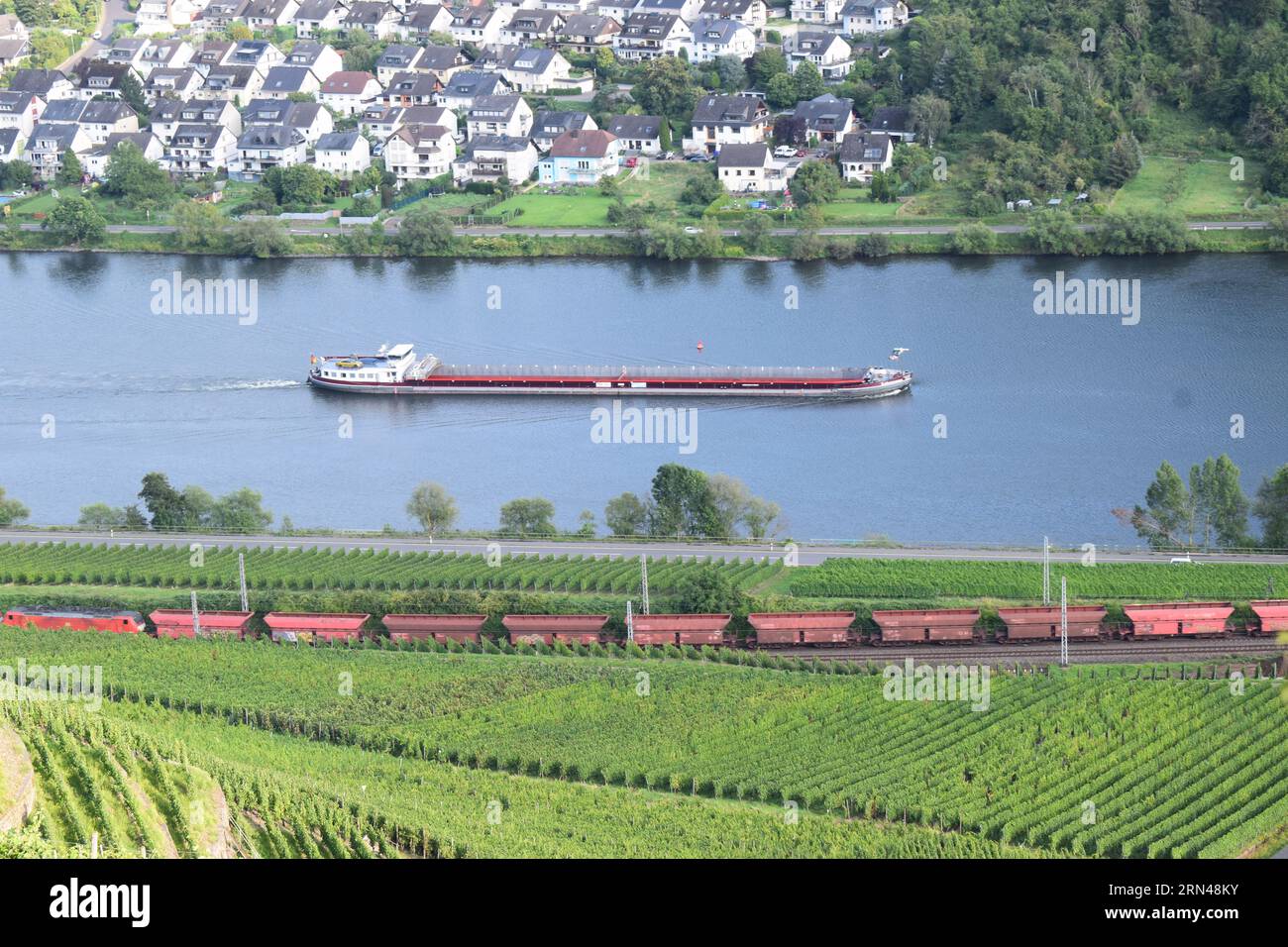 Cargo ship in Mosel valley during summer Stock Photo - Alamy