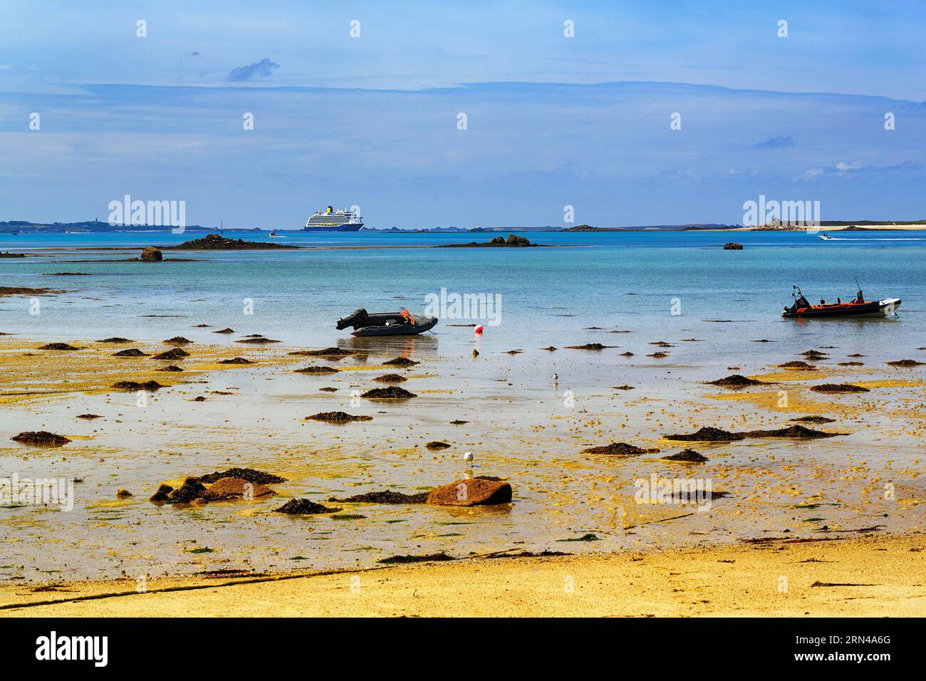 Boats off the coast of the Isles of Scilly, cruise ship of the British ...