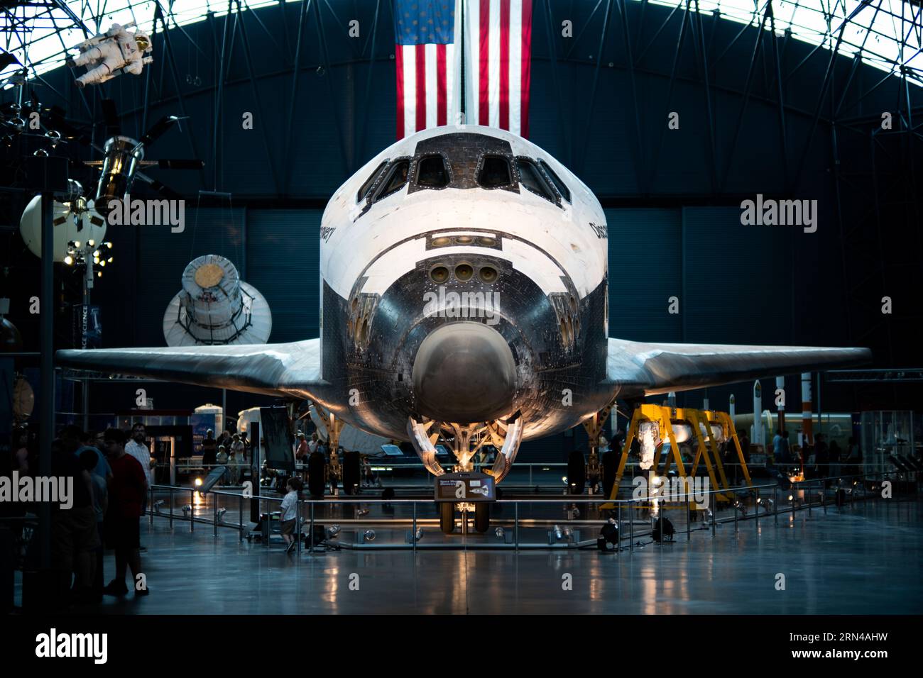 CHANTILLY, Virginia — Space Shuttle Discovery is prominently displayed ...