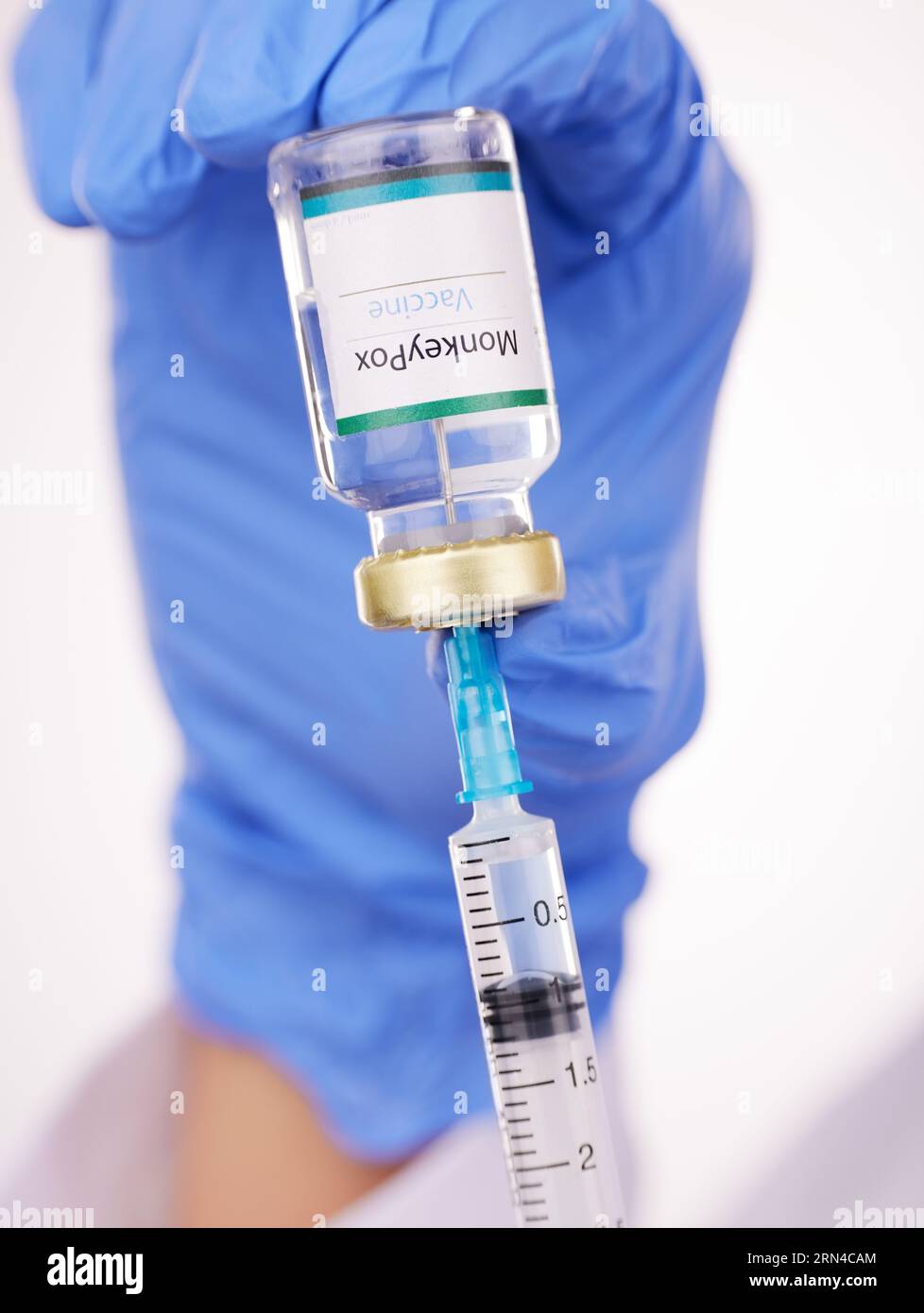 Doctor, hands and syringe with monkeypox vaccine for cure, flu shot or ...