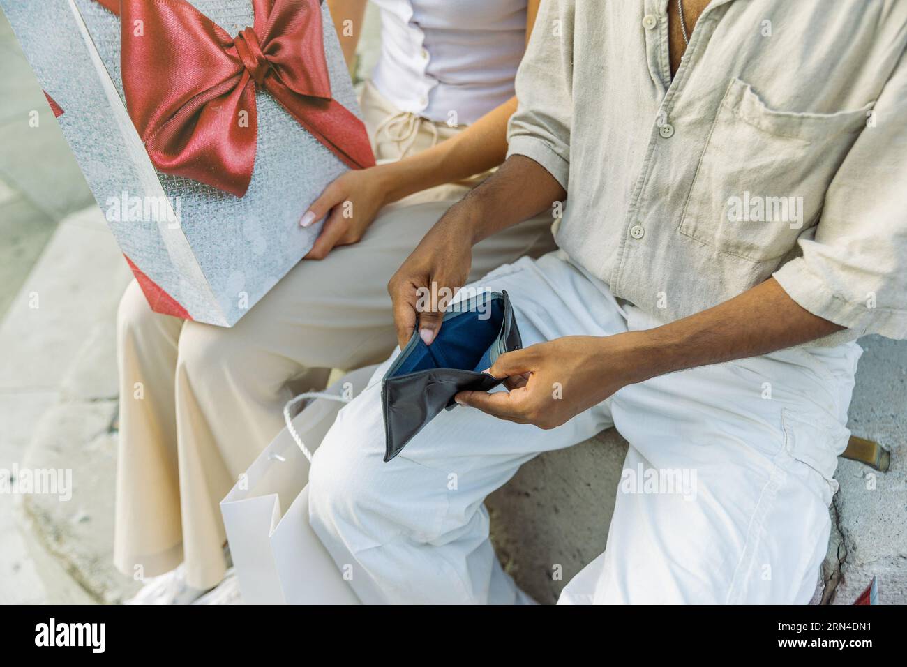 Man opens his wallet after shopping with his partner and it's empty, he ...