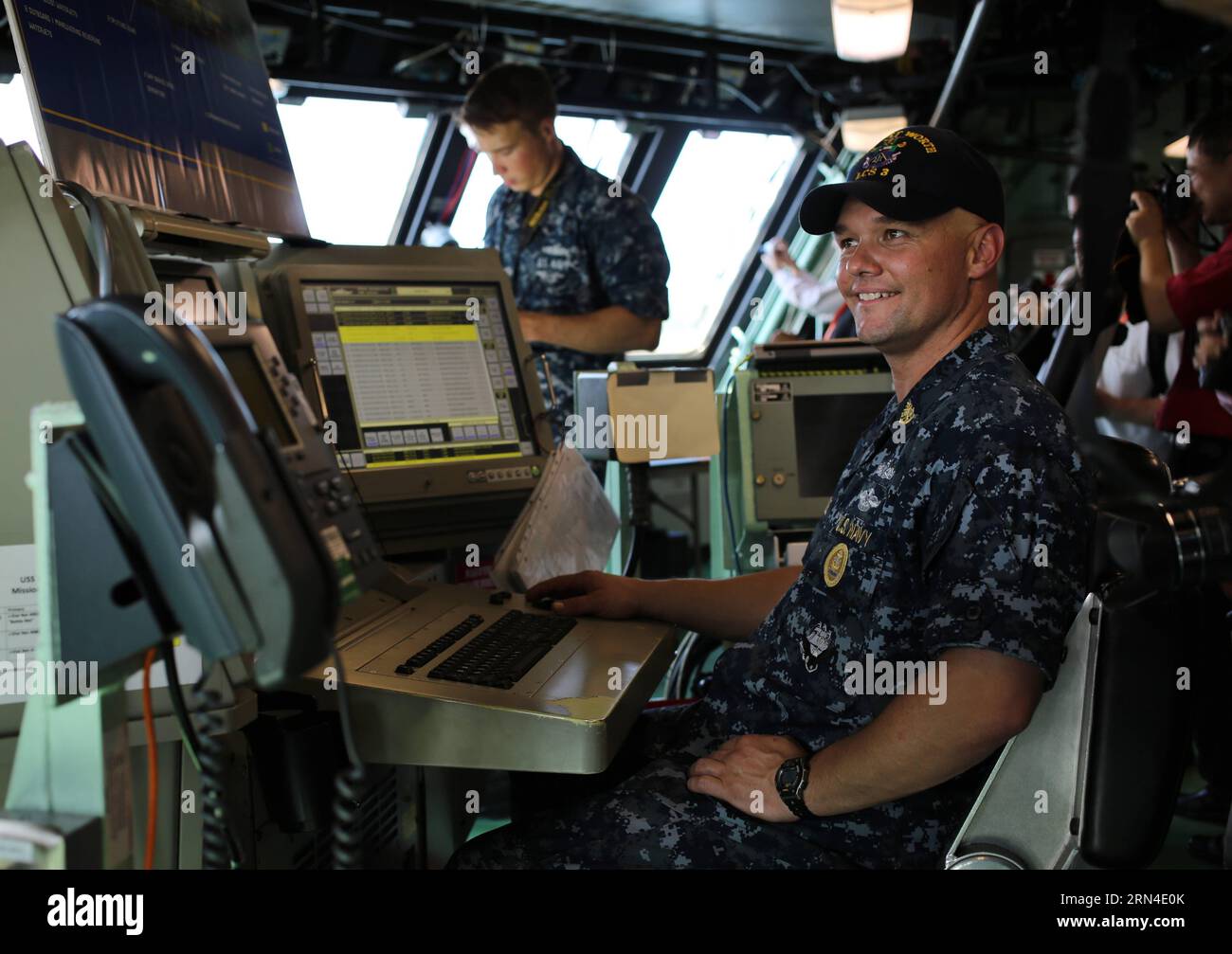 A U.S. Navy officer introduces a Freedom-class Littoral Combat Ship ...