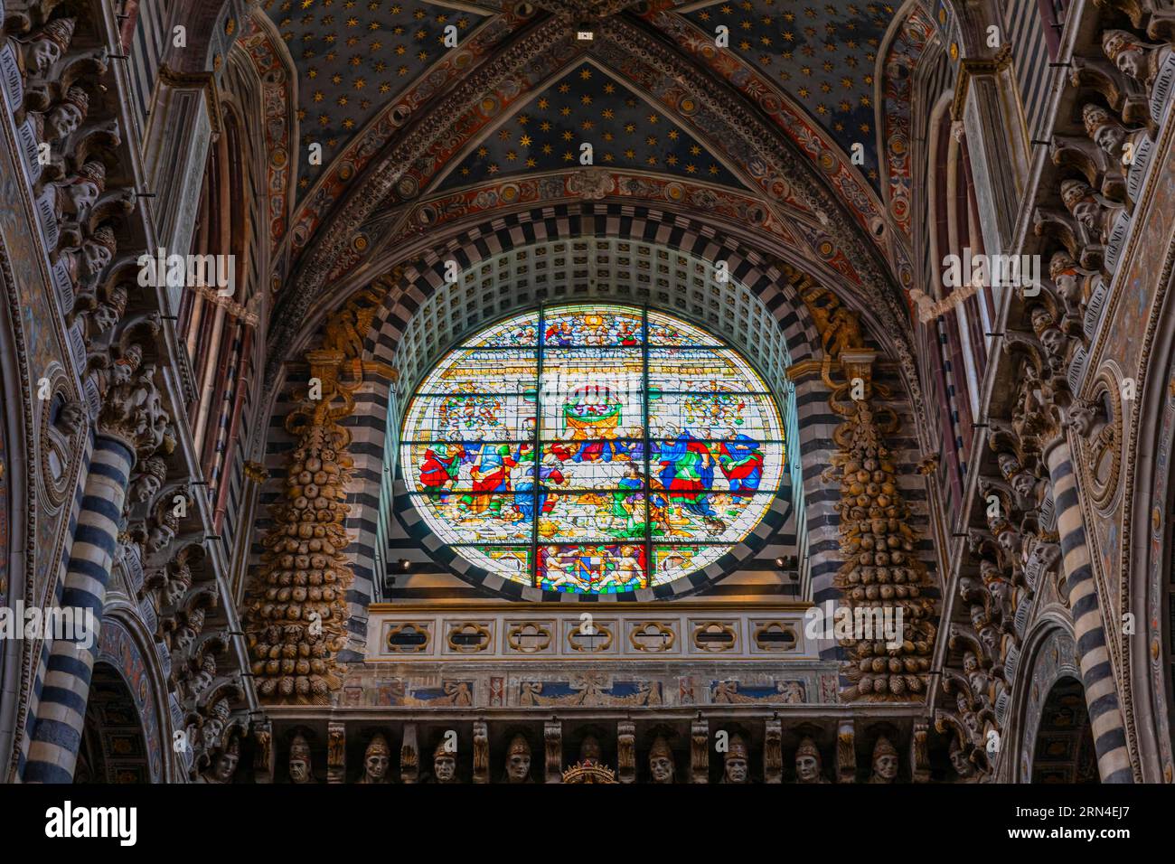Coloured round window in the cathedral with filigree decoration ...
