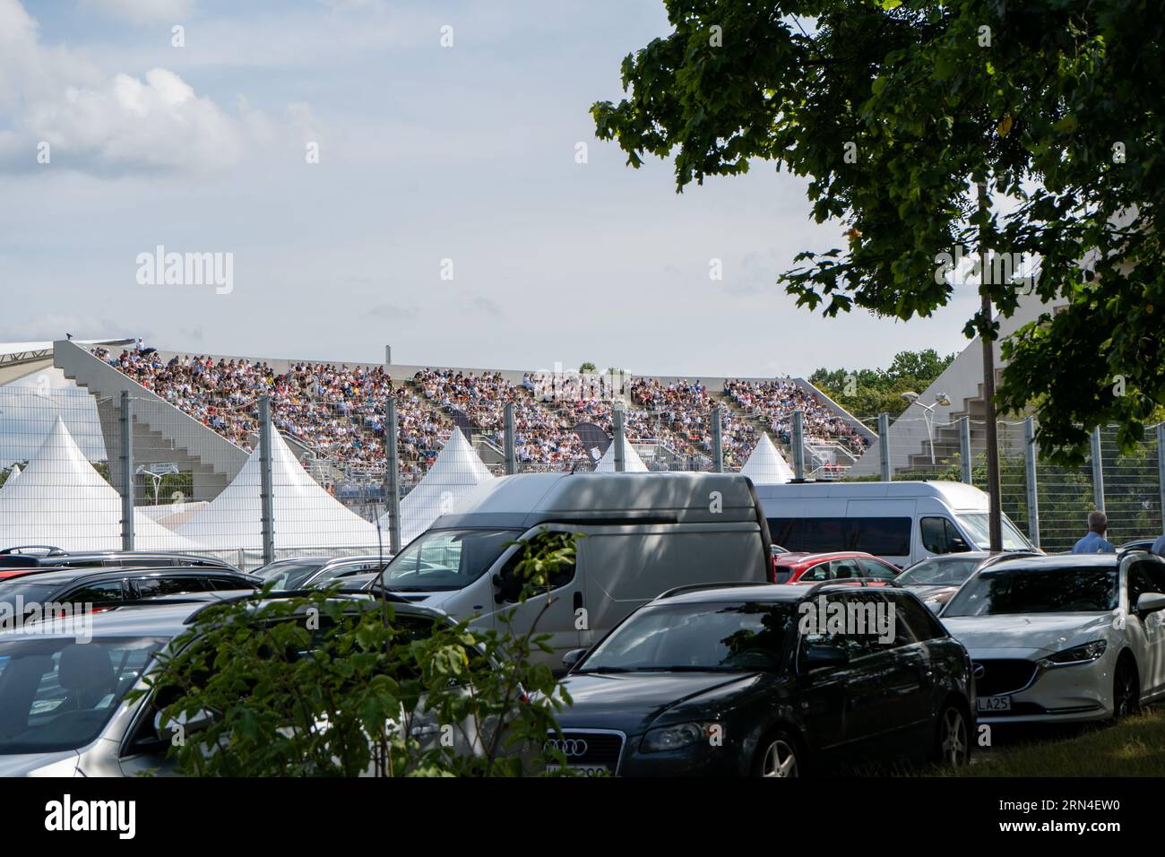 Tribune of the stadium. Crowded stands. Spectators in the open stadium ...