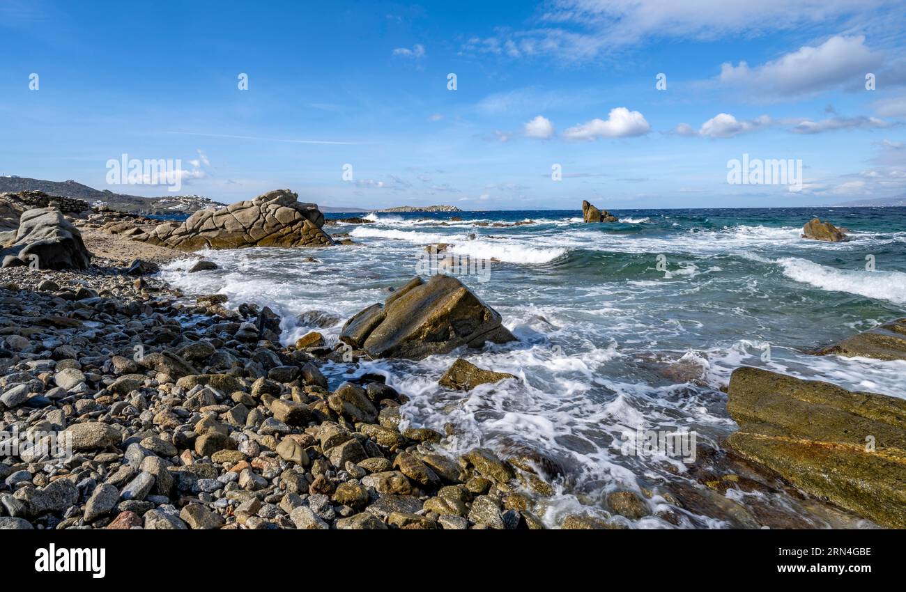 Beach with sand and rocks, Mykonos, Greece Stock Photo - Alamy