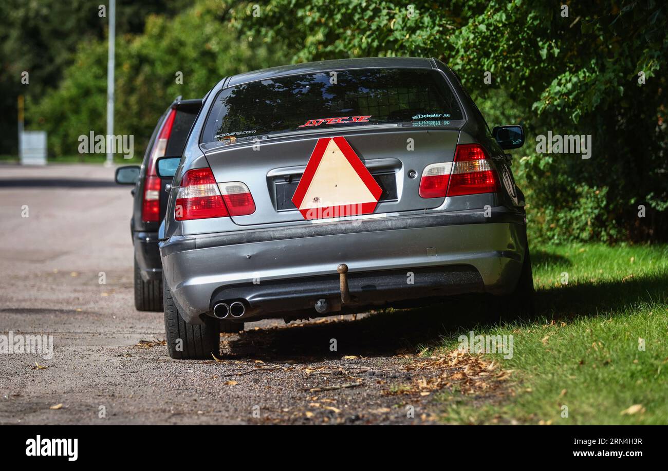 A BMW A-tractor, with the characteristic warning triangle for slow ...