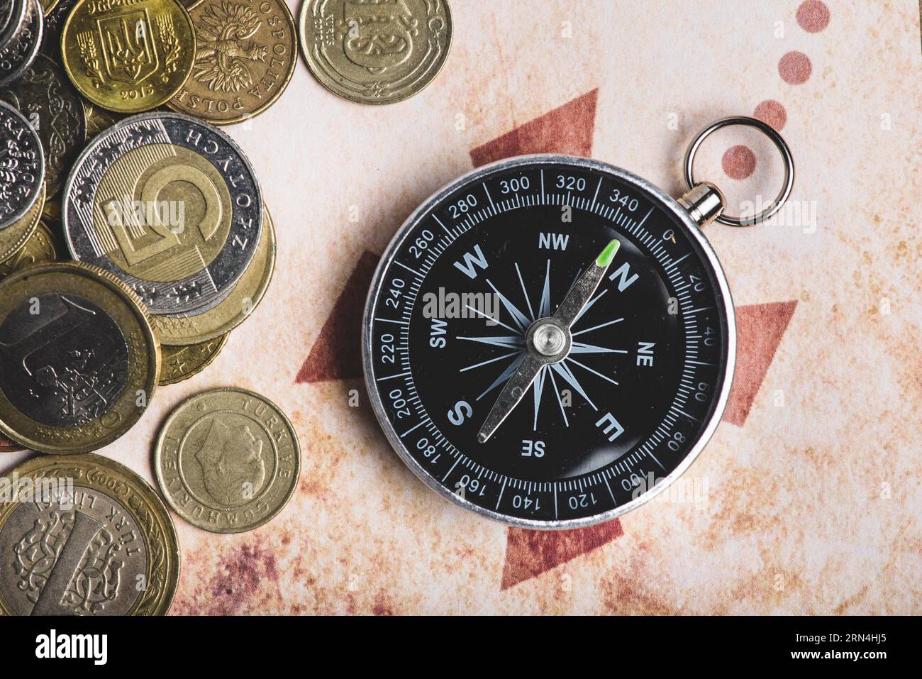 Close up coins compass Stock Photo - Alamy