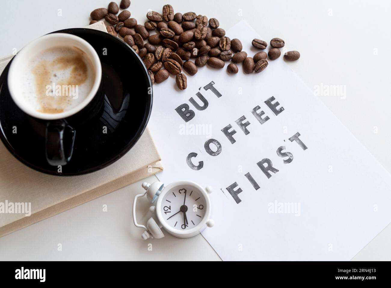 Coffee first quote with clock Stock Photo - Alamy
