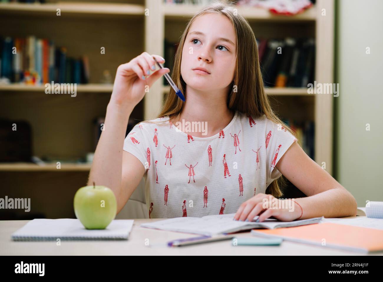 Dreamy girl studying Stock Photo - Alamy