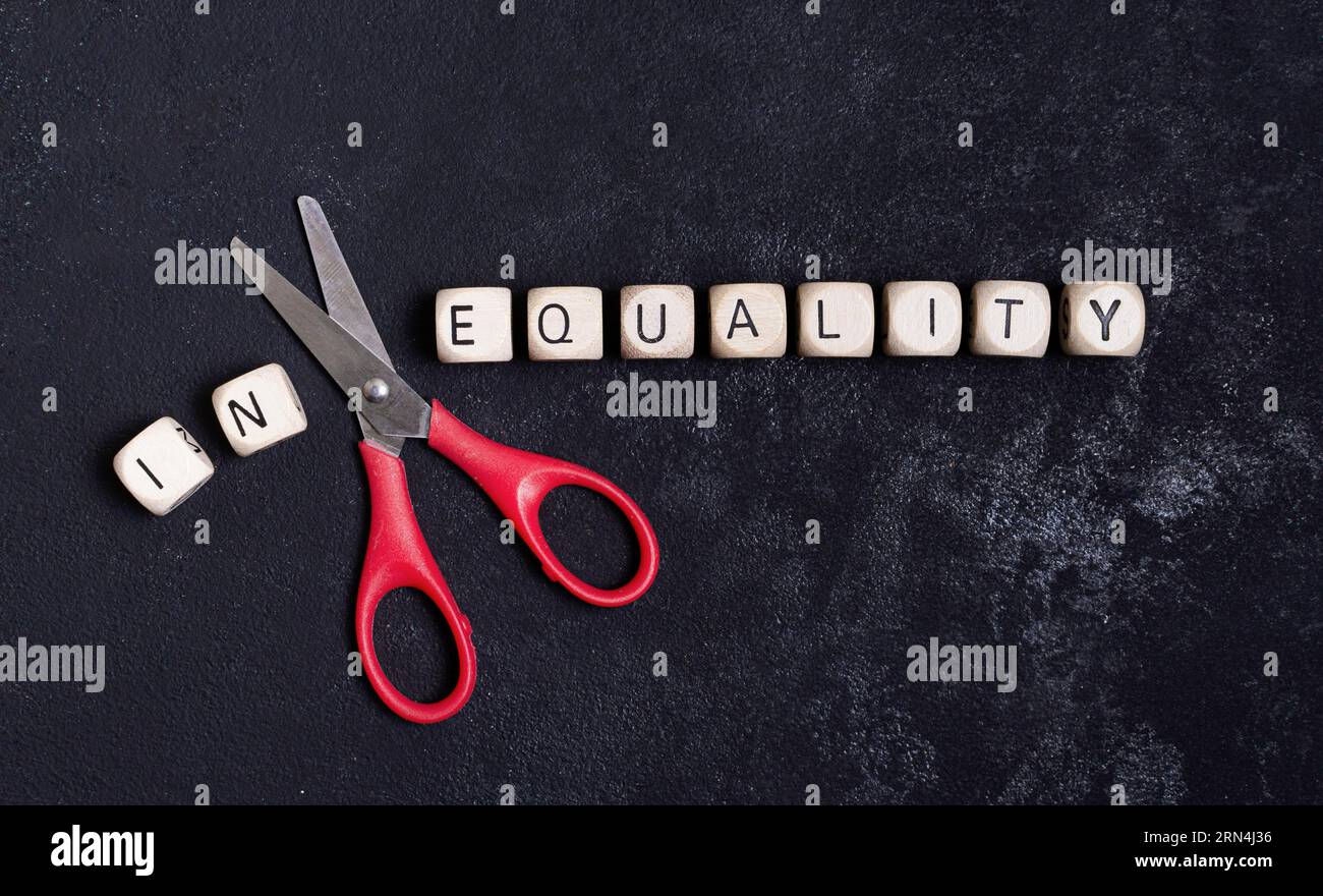 Equality inequality concept with scissors Stock Photo - Alamy