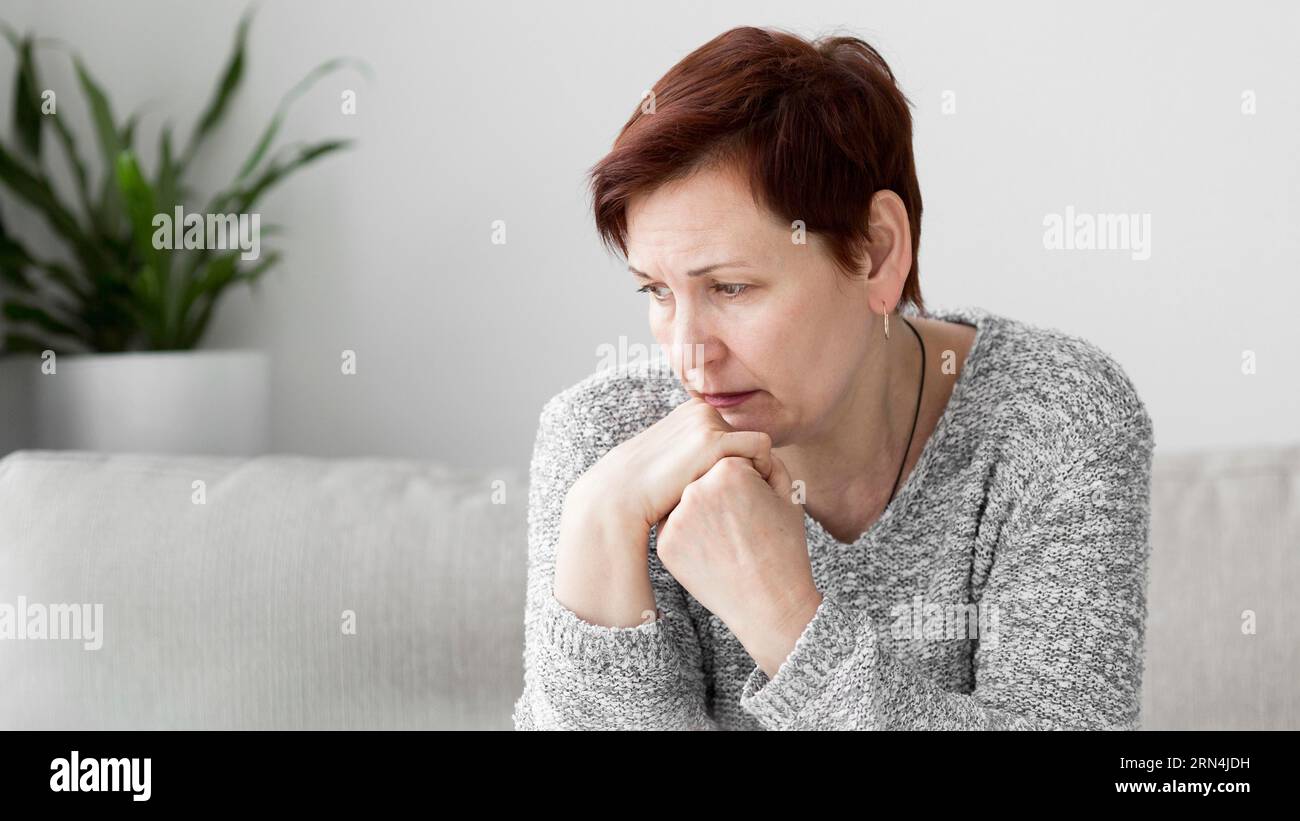 Front view woman with anxiety couch Stock Photo - Alamy
