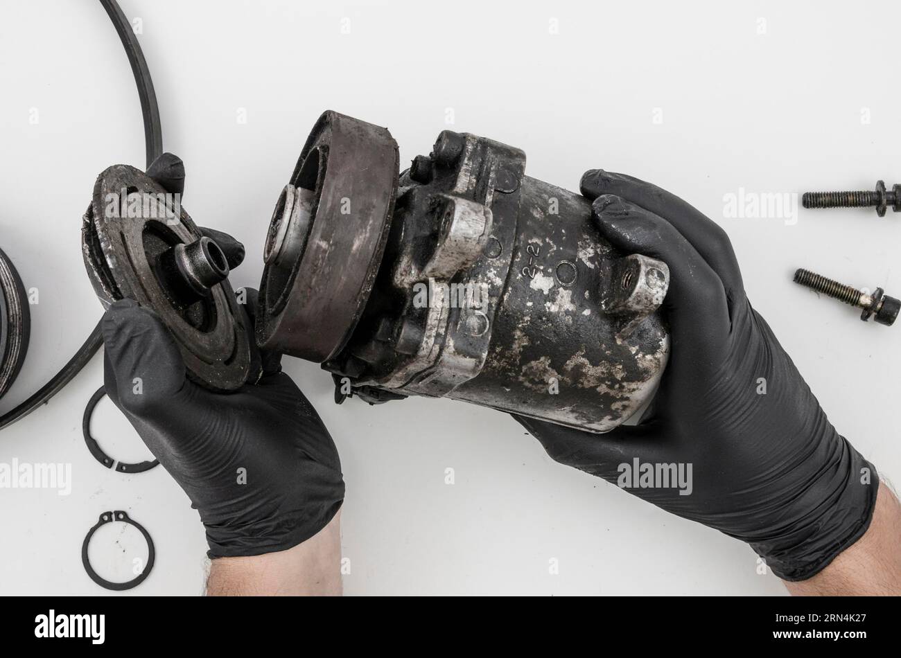 Man disassembling mechanical part cleaning Stock Photo - Alamy Man disassembling mechanical part cleaning Stock Photo - Alamy