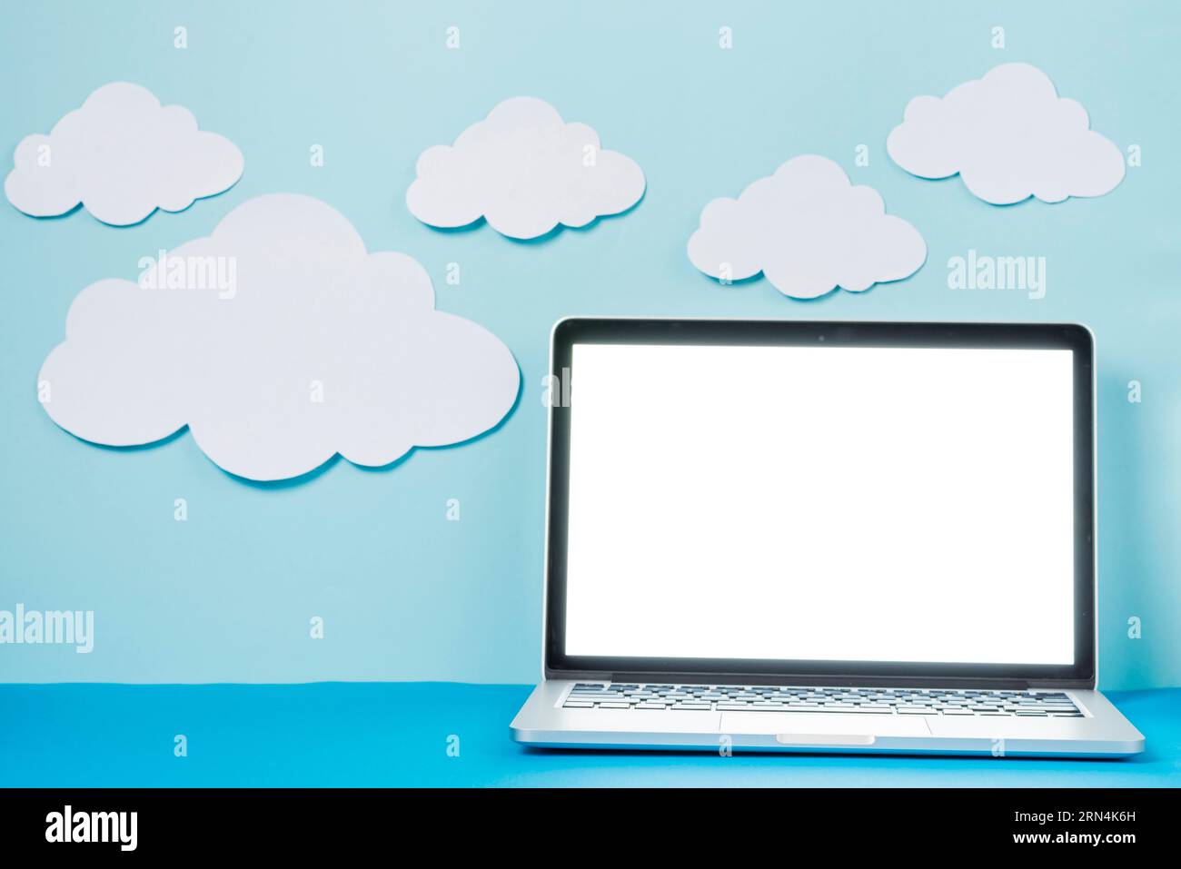 Laptop with paper hi-res stock photography and images - Alamy