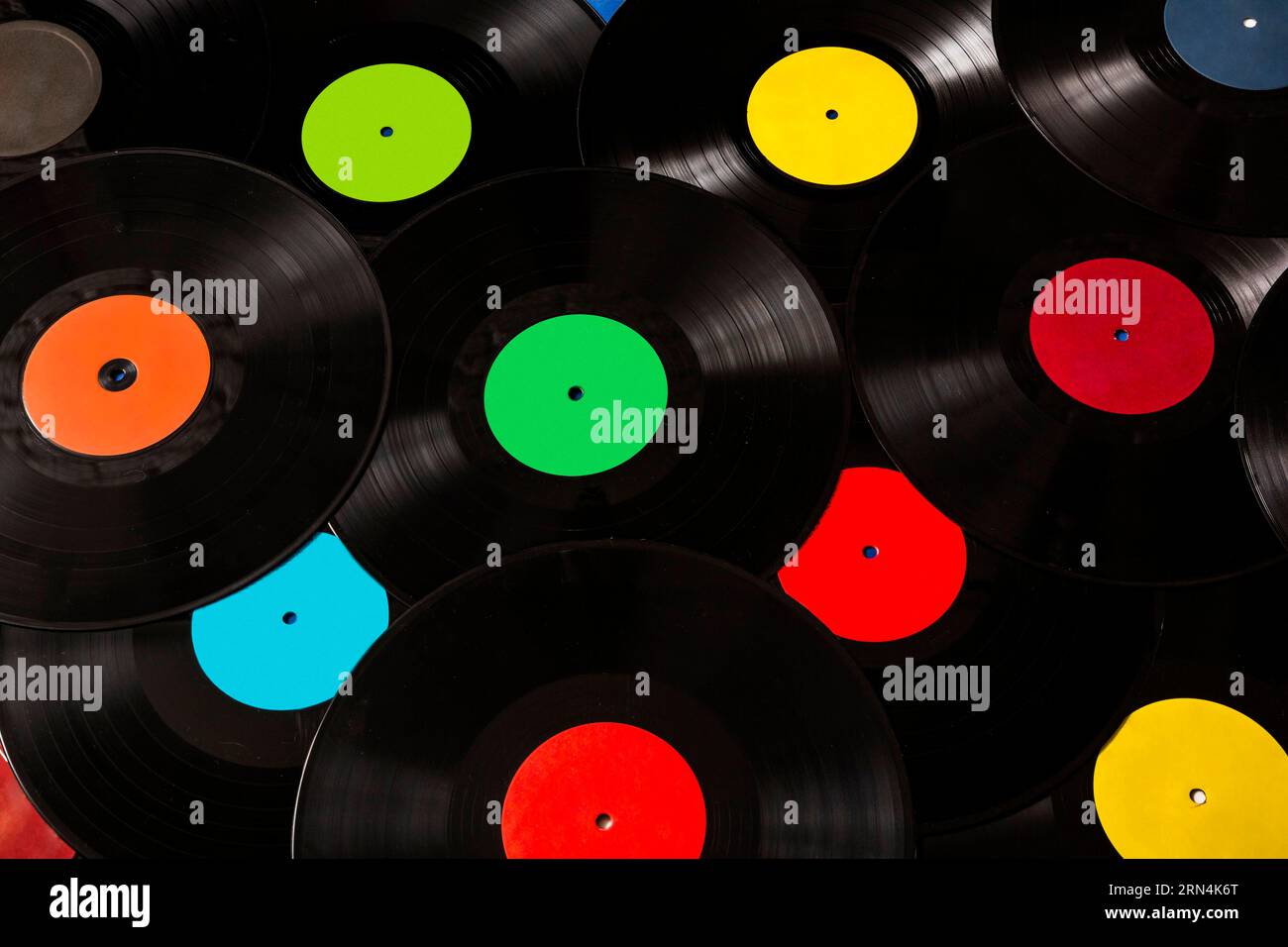 Many colorful black vinyl records Stock Photo - Alamy