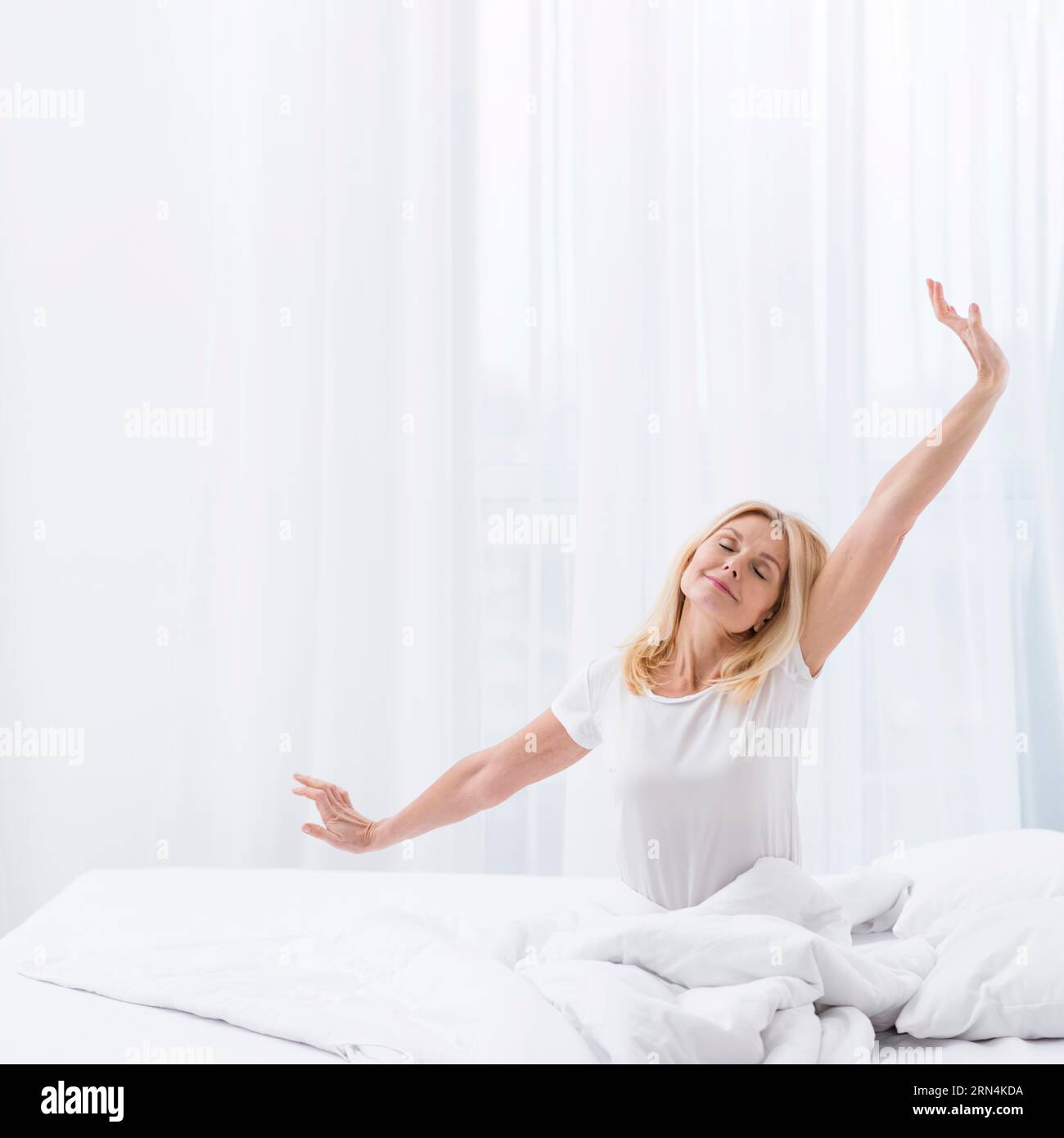 Beautiful woman waking up hi-res stock photography and images - Alamy