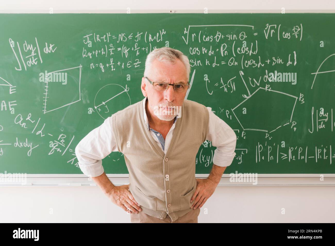 Serious aged professor lecture room looking camera Stock Photo - Alamy