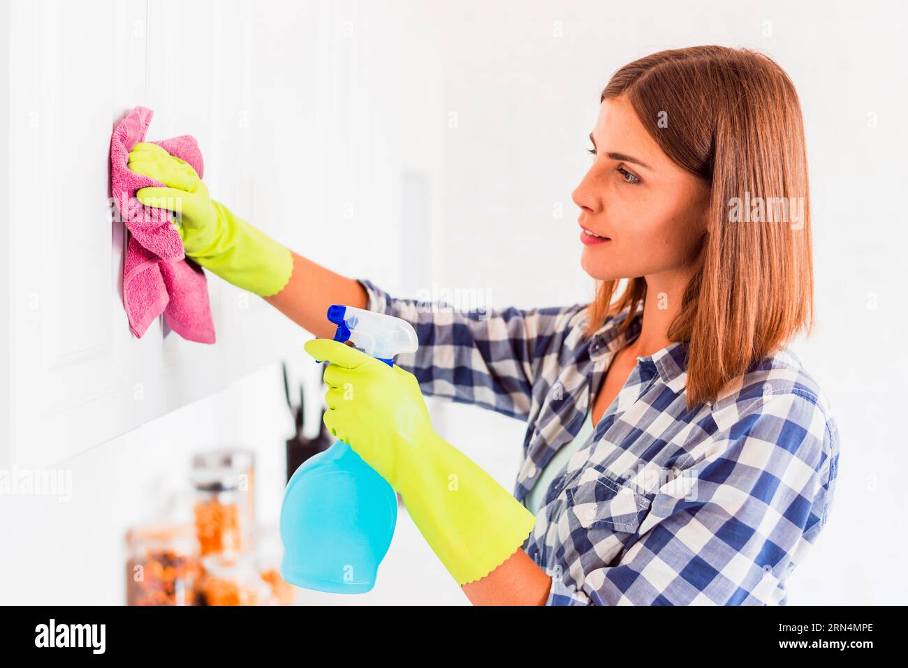 Young woman cleaning house hi-res stock photography and images - Alamy