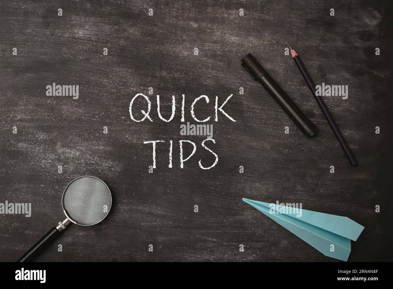 Text Quick Tips chalk on blackboard top view Stock Photo - Alamy