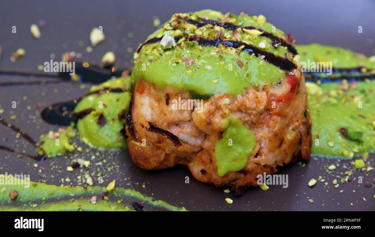 Antipasto, prawns, assembled into a round cylinder, pistachios ...