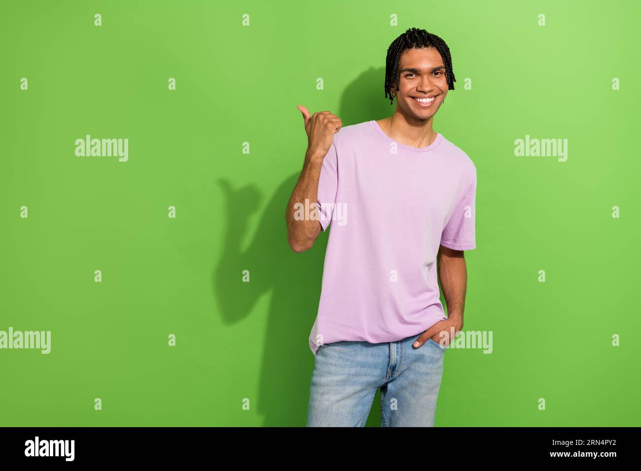 Photo of nice positive man toothy smile indicate thumb finger empty ...