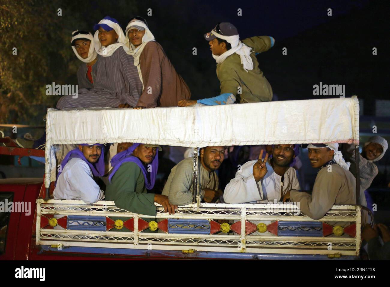 (150530) -- MINYA, - Egyptian quarry workers are transported with a ...