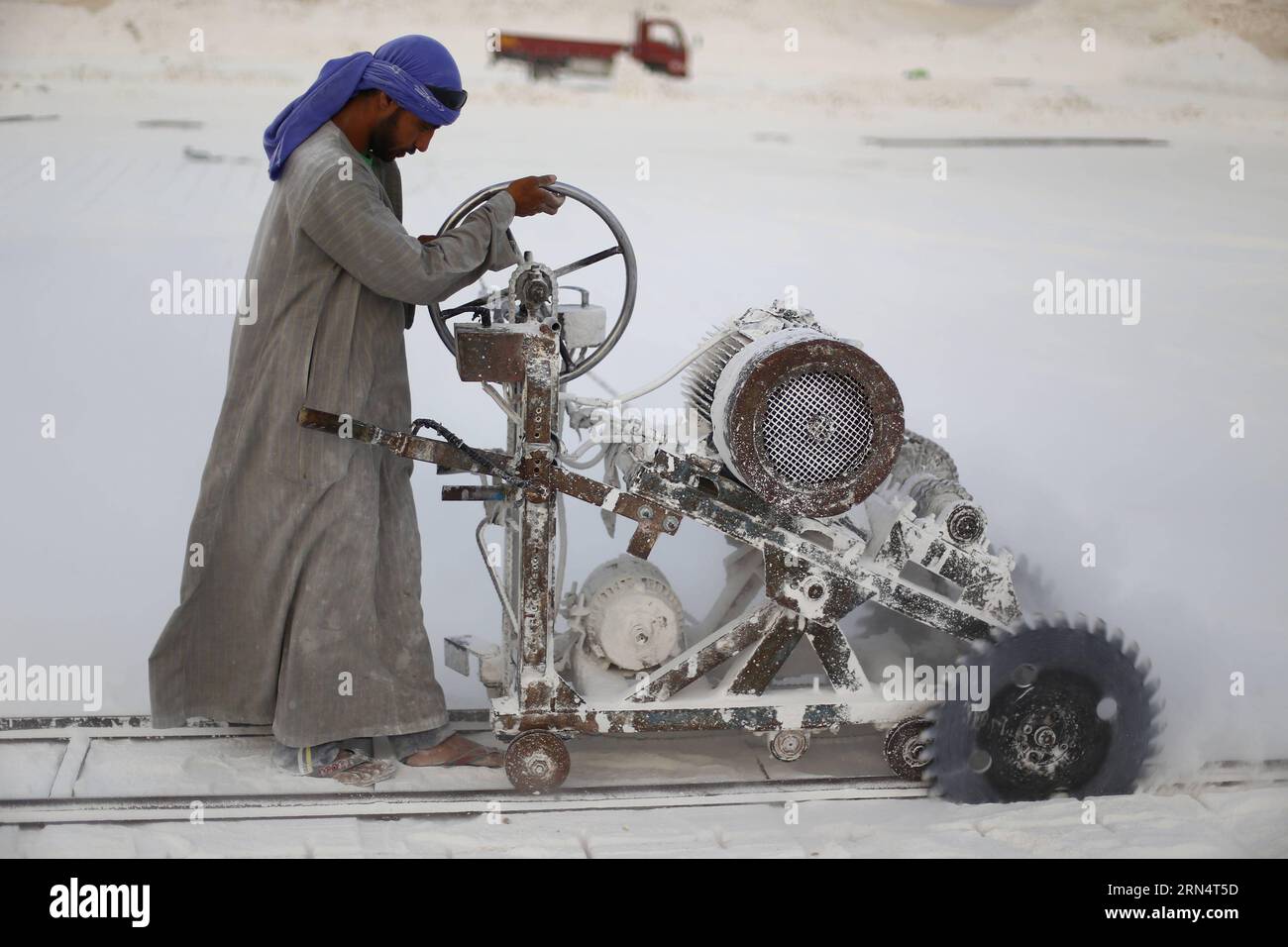 (150530) -- MINYA, - An Egyptian quarry worker works on a limestone ...