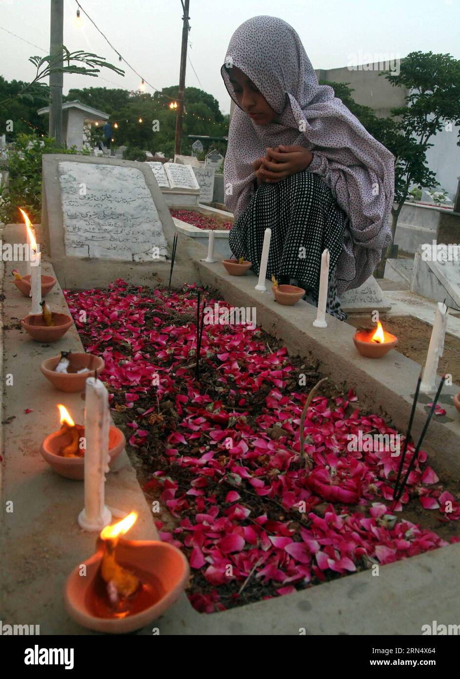 Muslim girl prays hi-res stock photography and images - Alamy